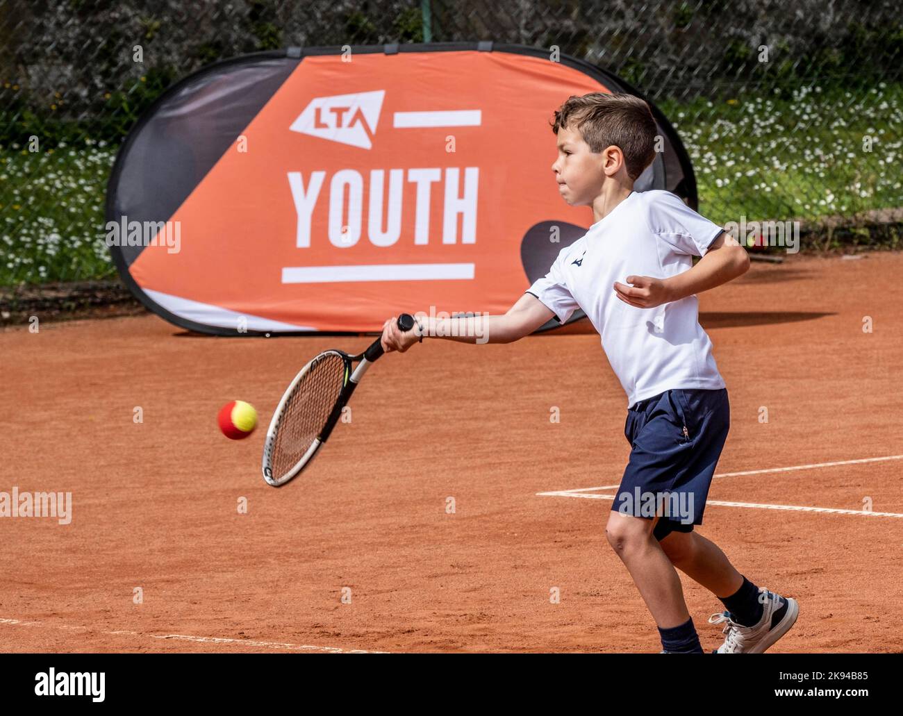 Children playing tennis and having tennis lessons Stock Photo - Alamy