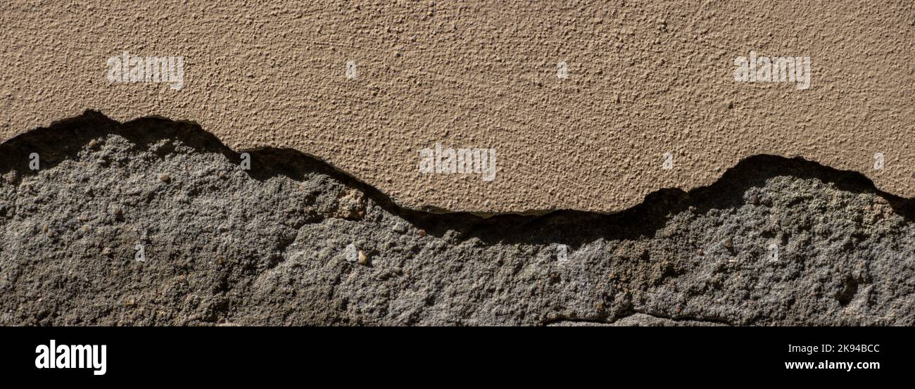 Old sandstone wall with thick pieces of plaster broken off Stock Photo ...