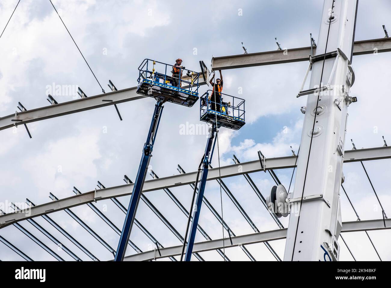 Building construction showing steel beams and working at height Stock ...