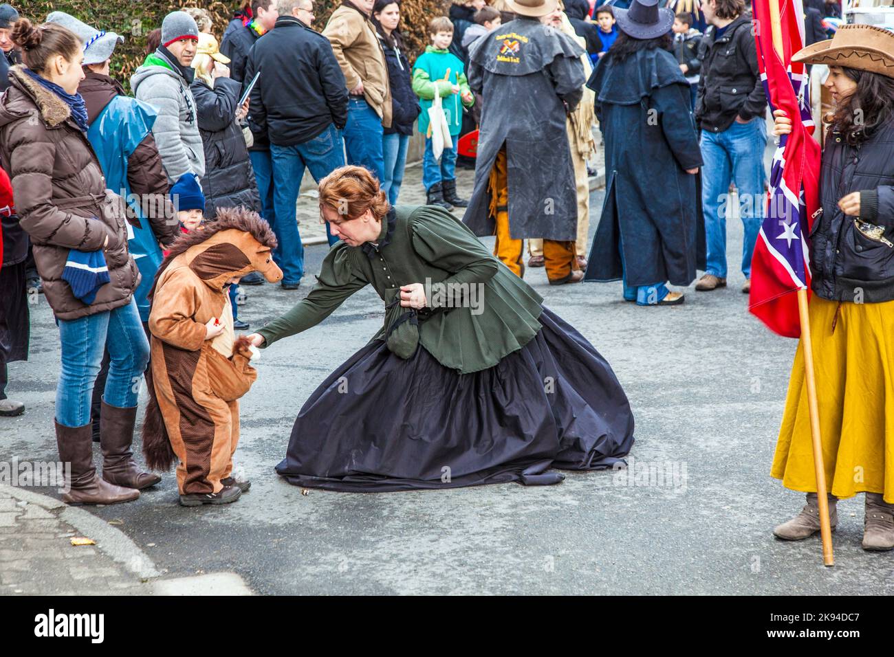 SCHWALBACH, GERMANY - FEBRUARY 27: people watch the carnival parade and ...