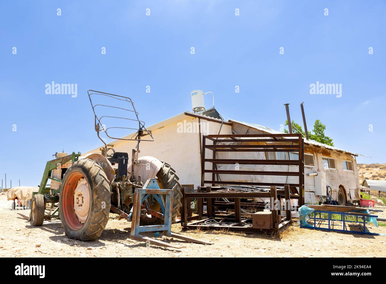 An abandoned construction area with tractor and metal equipment Stock ...