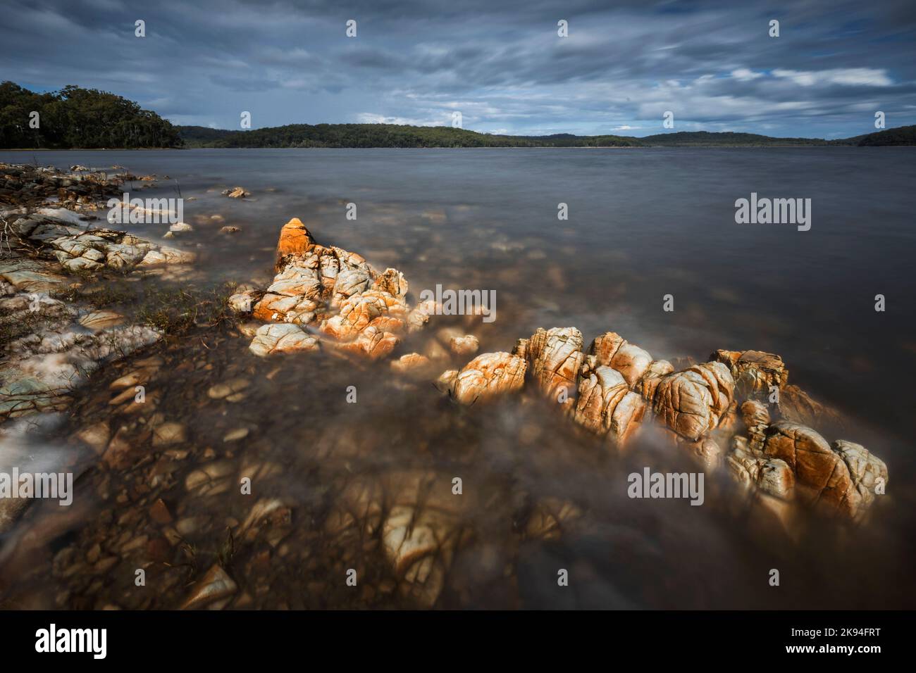 The Rocks in water at Smiths Lake on NSW mid north Coast in Australia Stock Photo - Alamy
