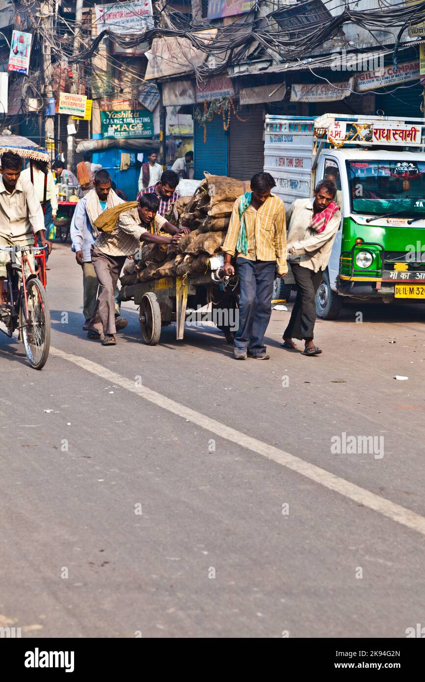 Delhi, India - November 9, 2011: a pushcart is pulled by people early ...