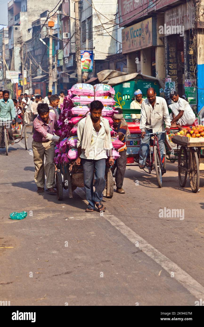 Delhi, India - November 9, 2011: A pushcart is pulled by people early ...