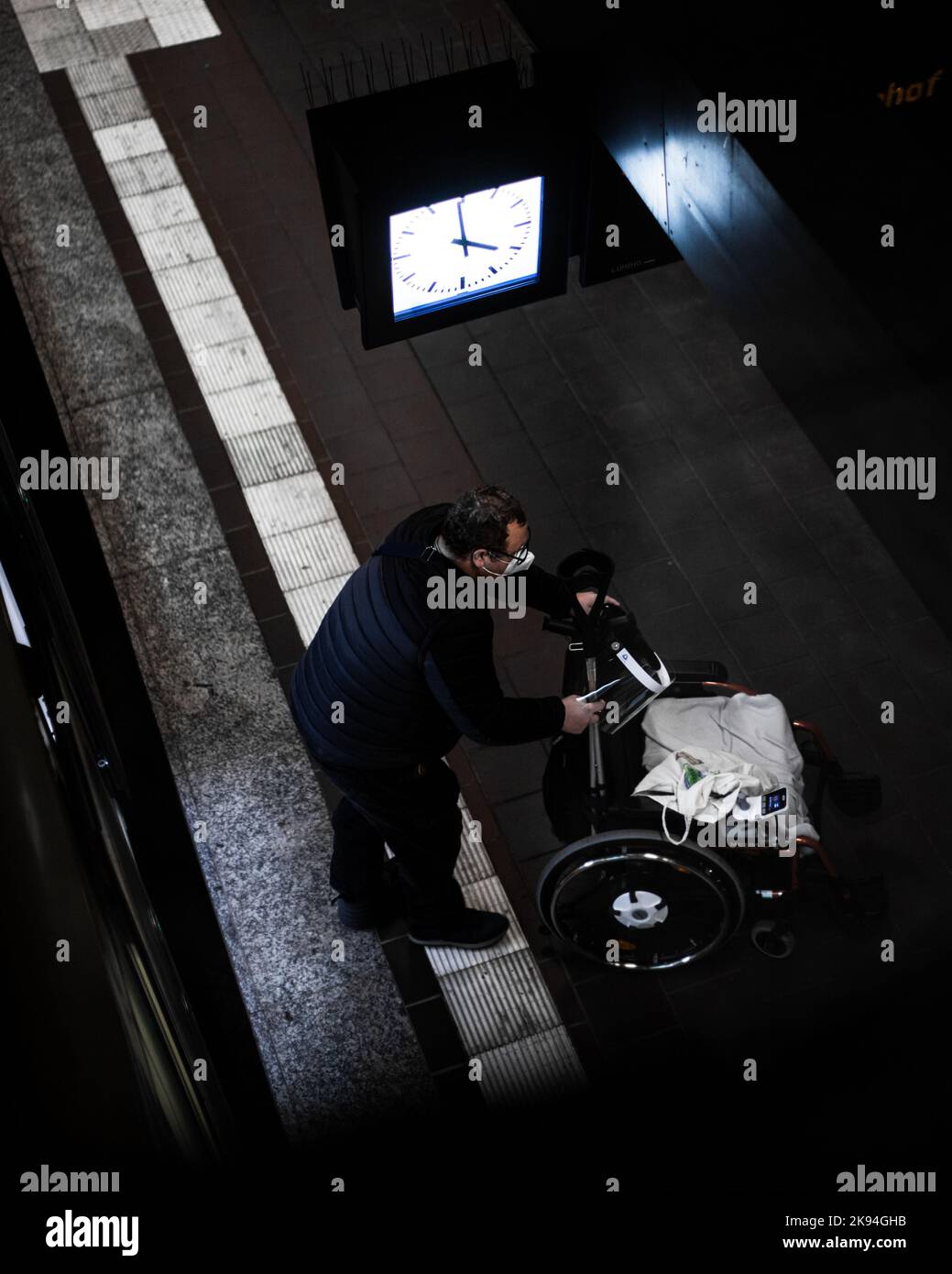 A male pushing a wheel chair out of a train in Stuttgart Stock Photo ...
