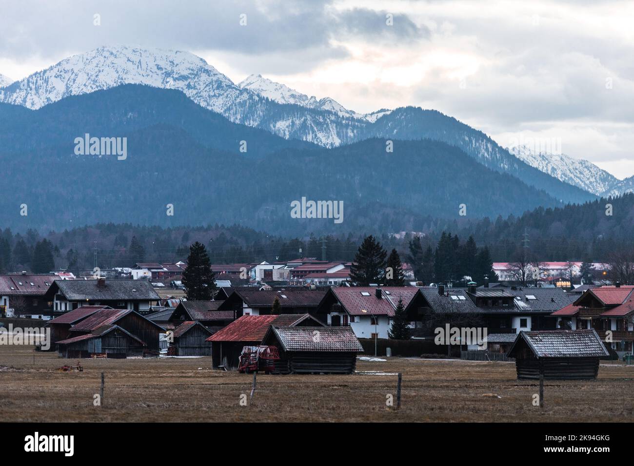 A small rural houses with trees and mountain in the background Stock ...