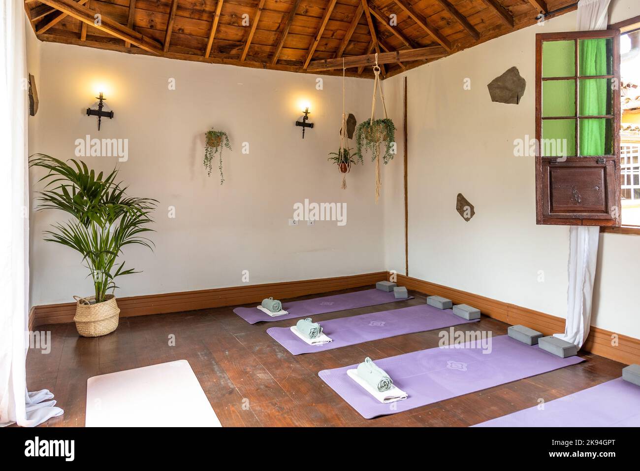A yoga room interior with plants and an open window Stock Photo - Alamy