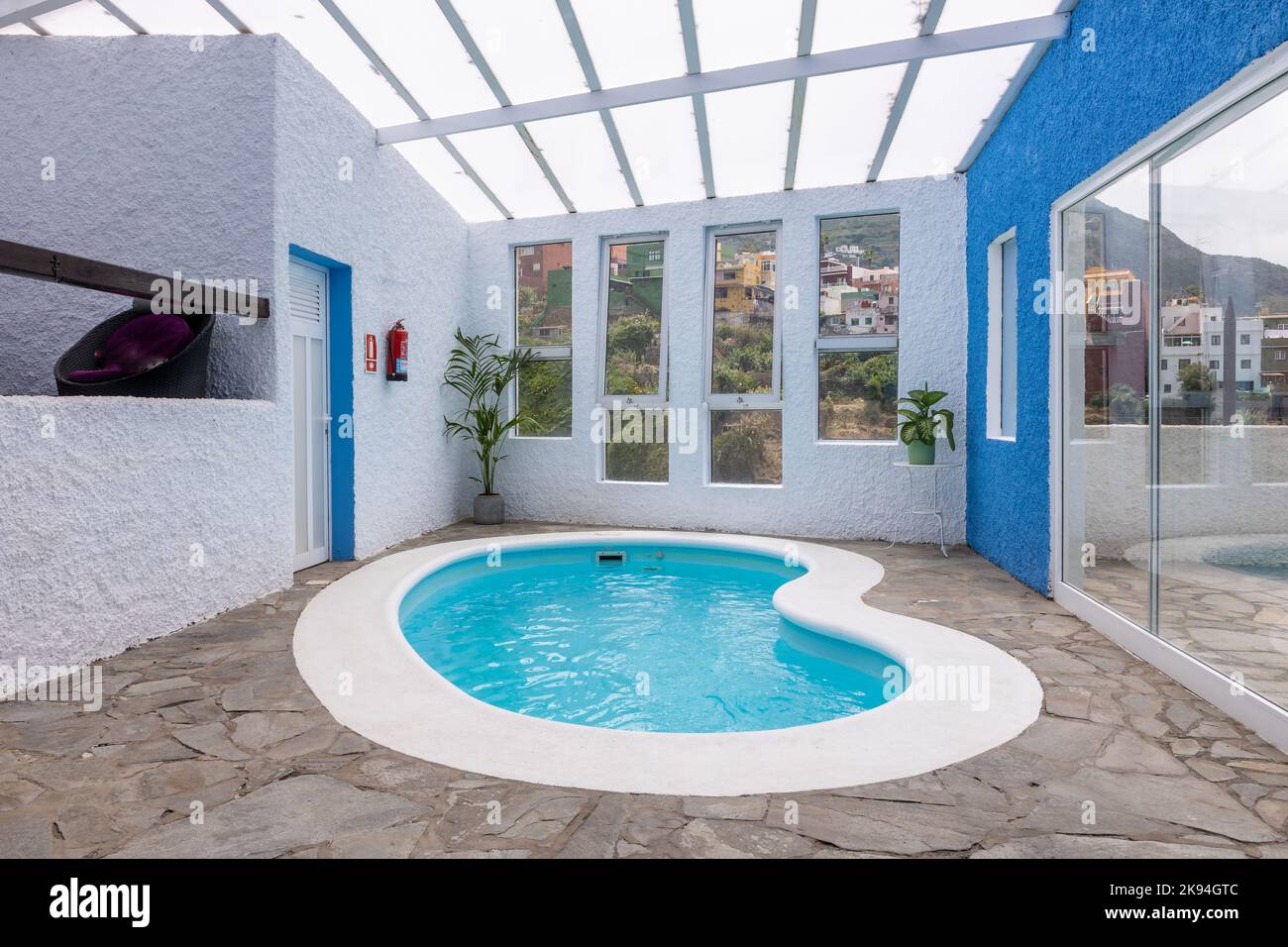 A small poolside against a beautiful view of a town Stock Photo - Alamy