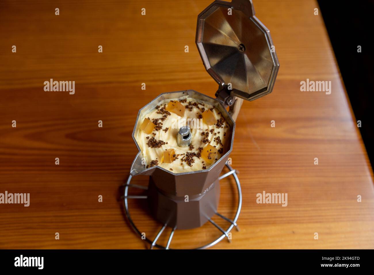 A high angle view of a dessert in a geyser coffee maker on the table ...