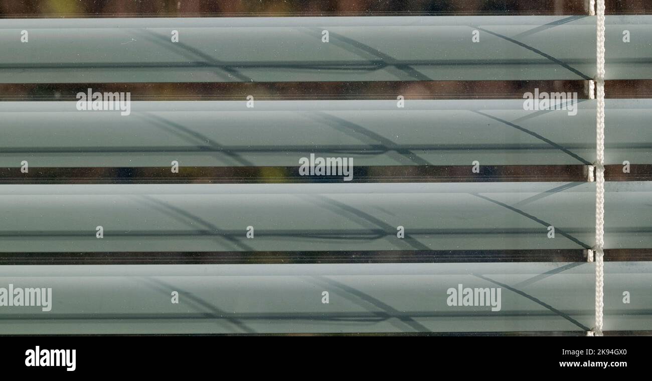 dusty window with horizontal lines of Venetian blinds Stock Photo - Alamy