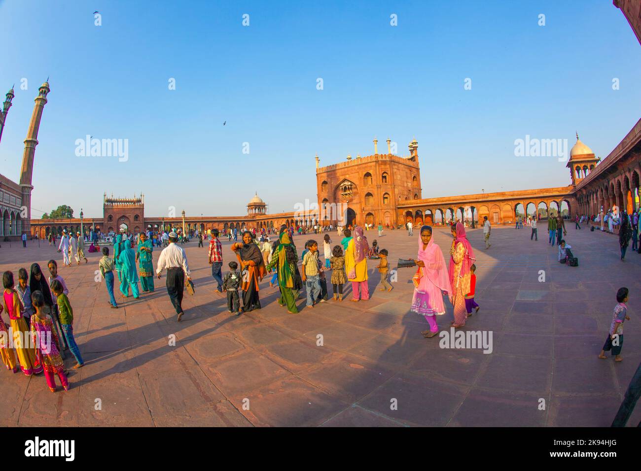 DELHI, INDIA - NOVEMBER 8: A group of worshipers rest on the courtyard ...