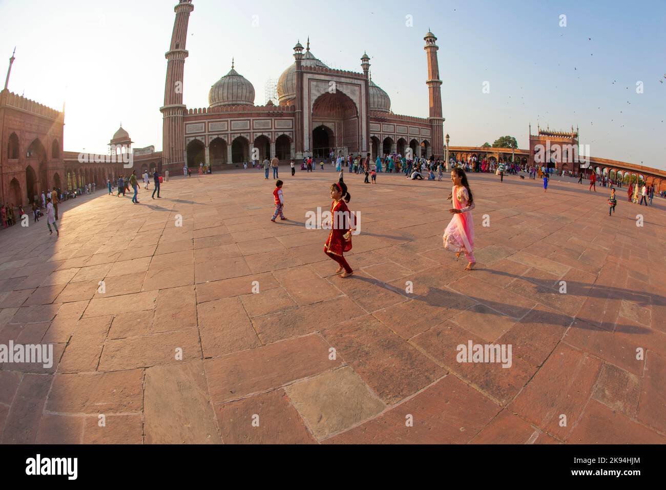 DELHI, INDIA - NOV 8: A group of worshipers rest on the courtyard of ...