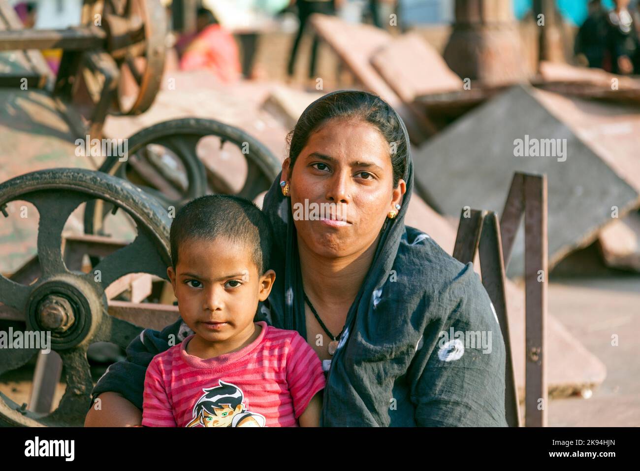 DELHI, INDIA - NOV 8: mother with child rests on the courtyard of Jama ...