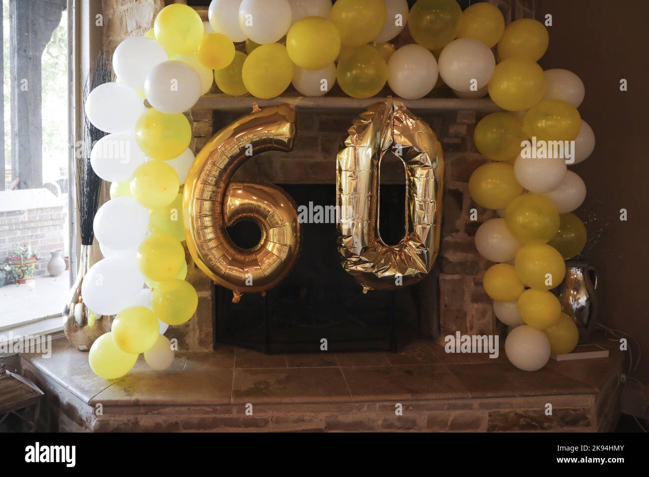 A large inflated golden balloon of number 60 Stock Photo - Alamy