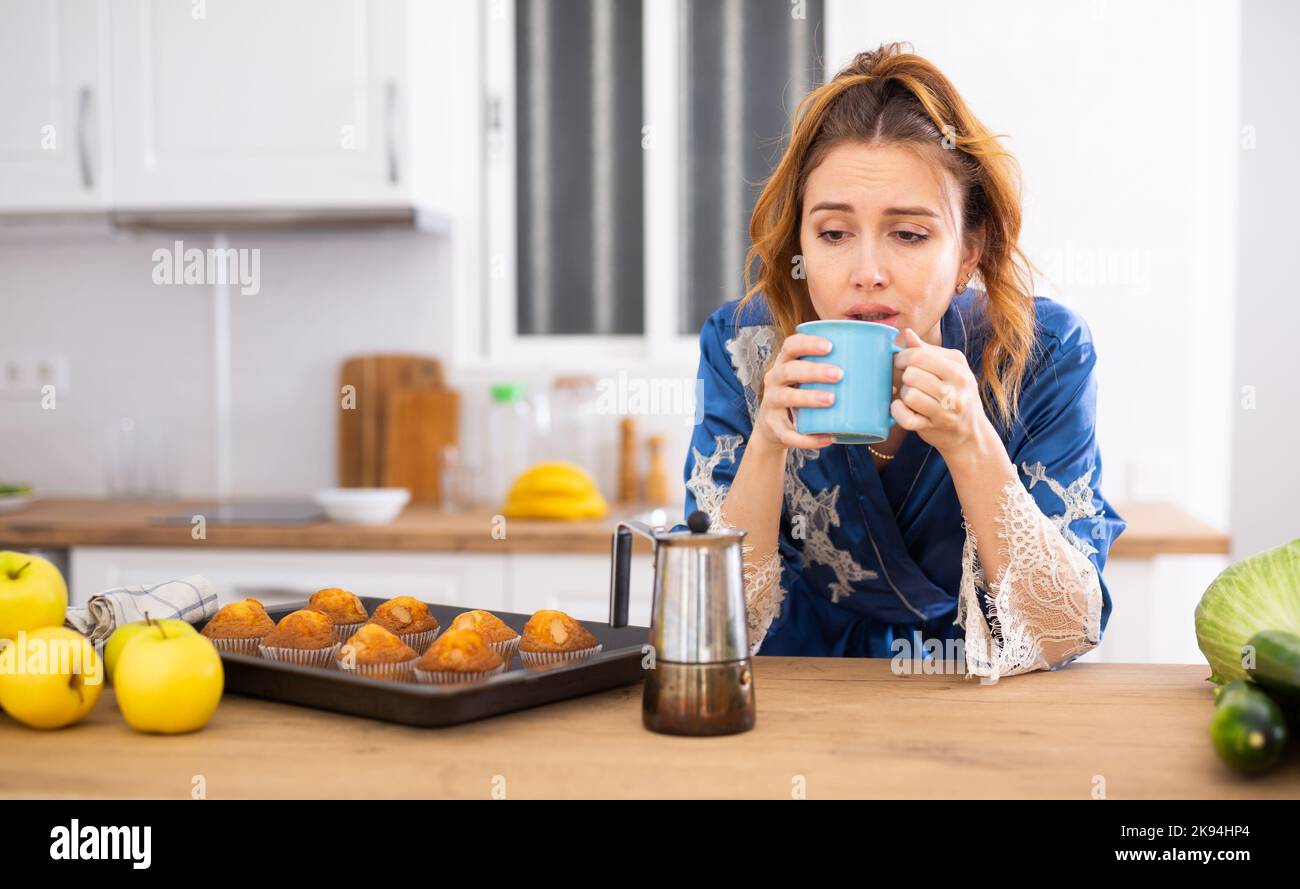 Woman making coffee sad hi-res stock photography and images - Alamy
