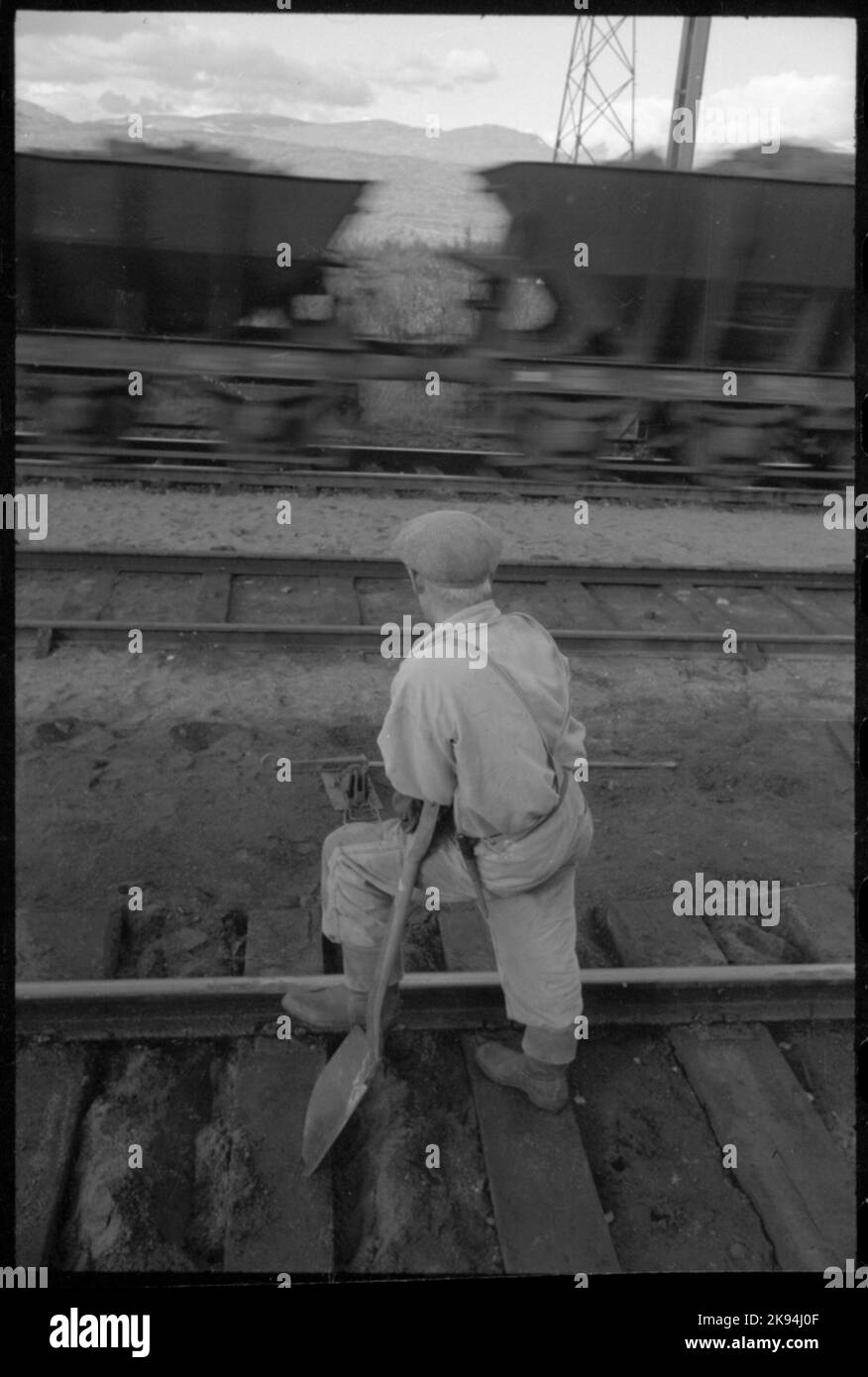 Track workers and passing ore trains Stock Photo - Alamy