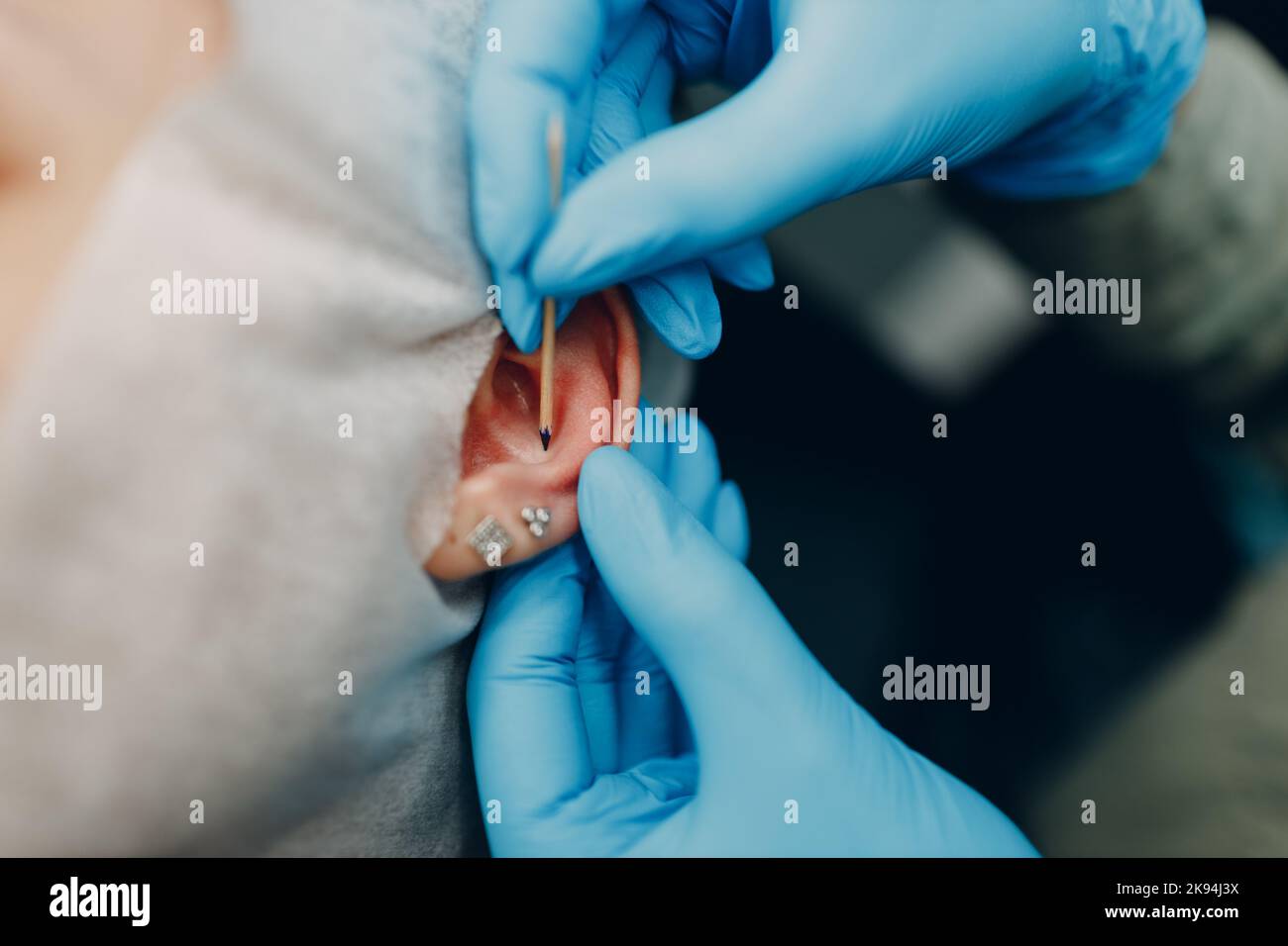 Ear piercing woman close up hi-res stock photography and images - Alamy