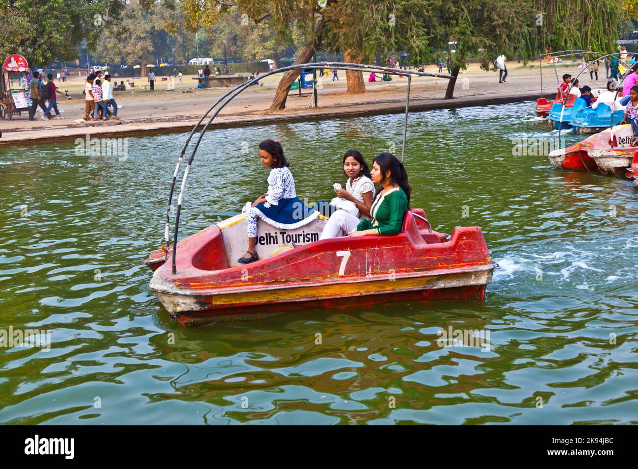 DELHI, INDIA - NOV 14: people enjoy boating on the artifical lake by ...