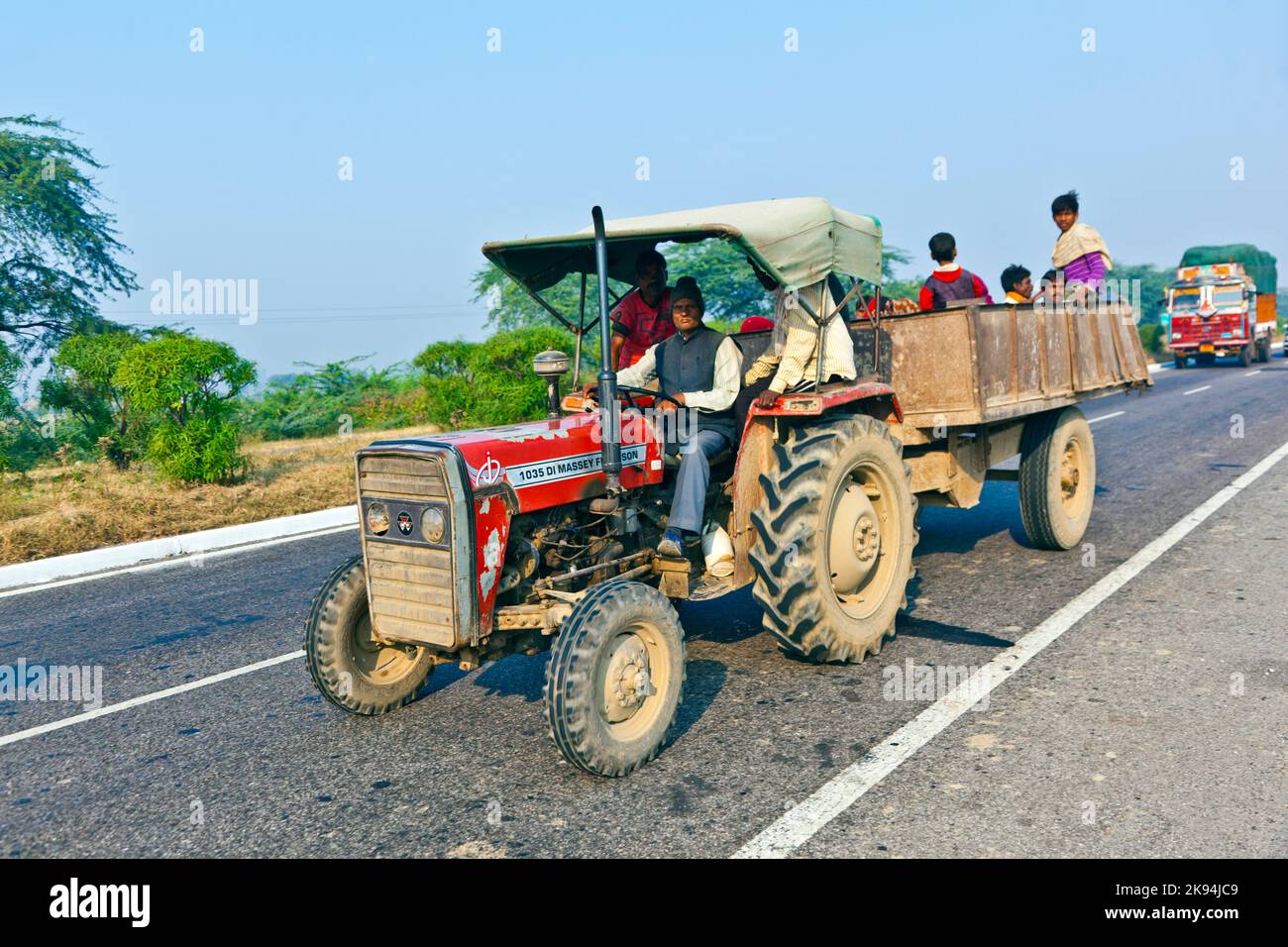 AGRA, INDIA - NOVEMBER 16: people in overloaded cars on the Highway on ...