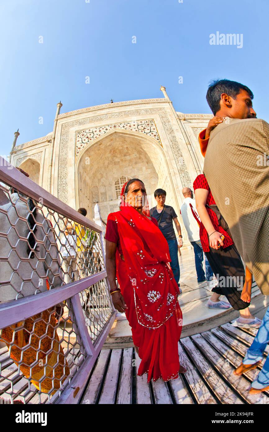 AGRA, INDIA - NOVEMBER 16: Indian tourists walk around the Taj Mahal on ...