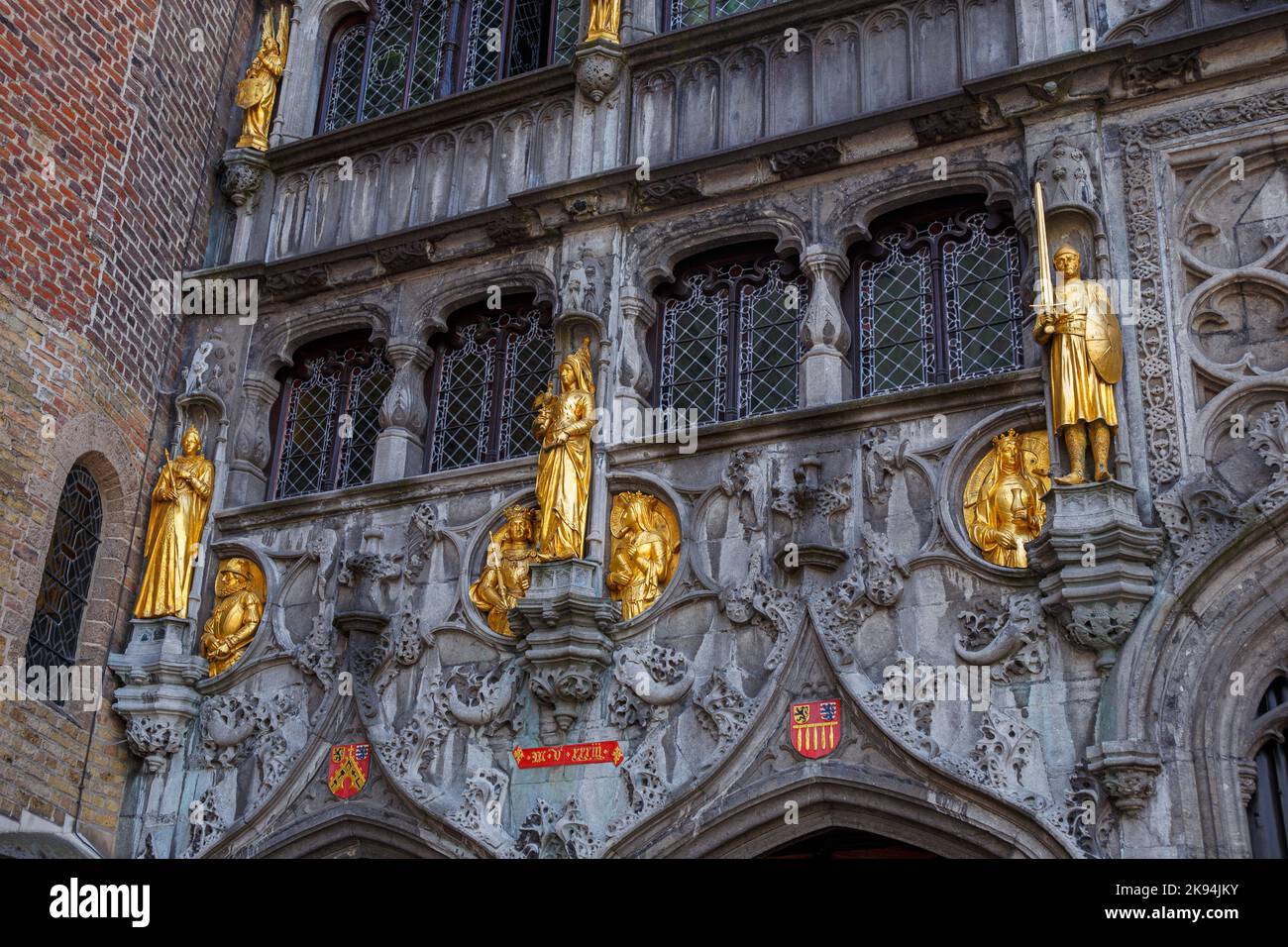 The gilded antique statues and the detail on the facade of Basilica of ...