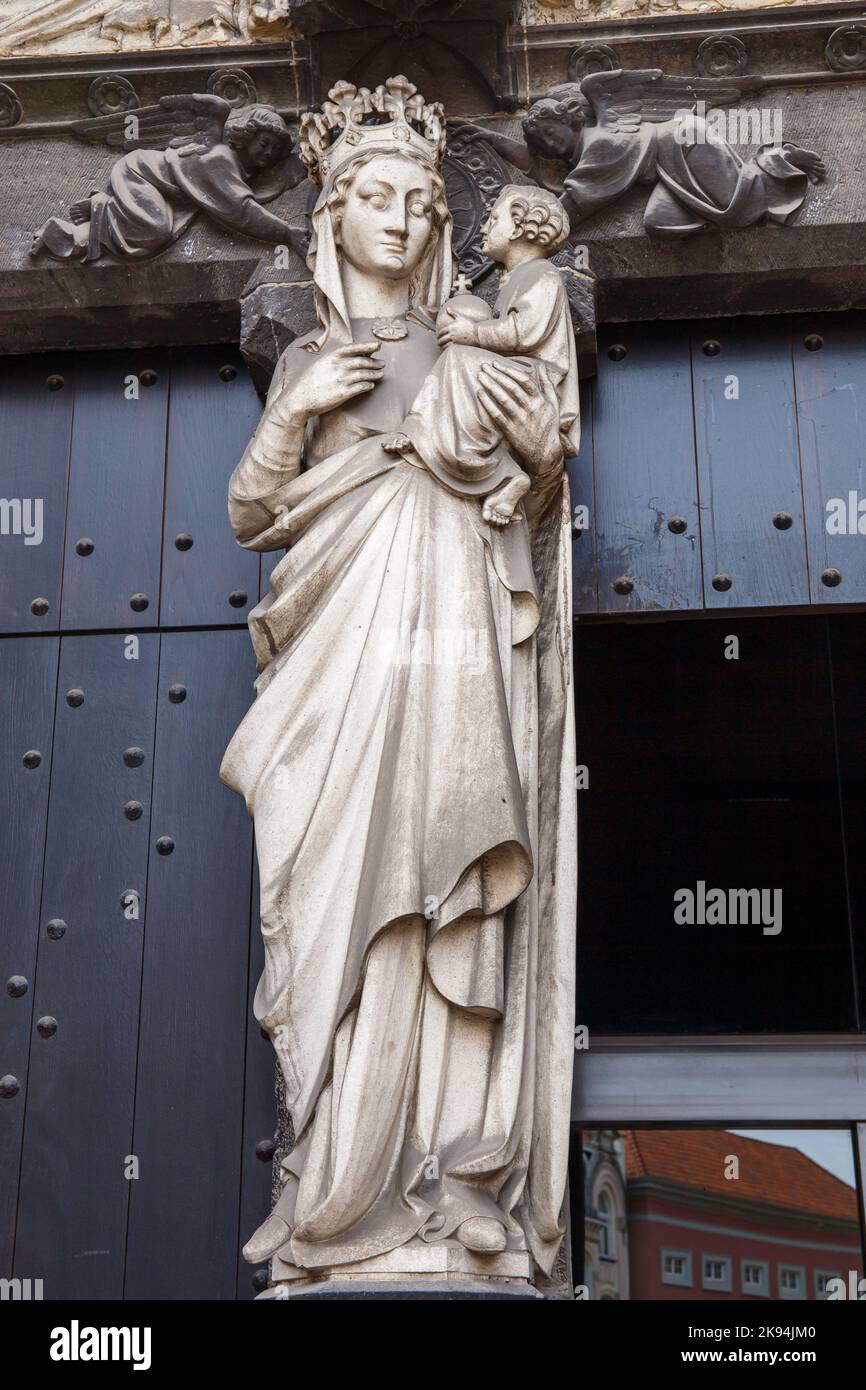 A vertical shot of the Madonna of Bruges marble sculpture at Church of ...
