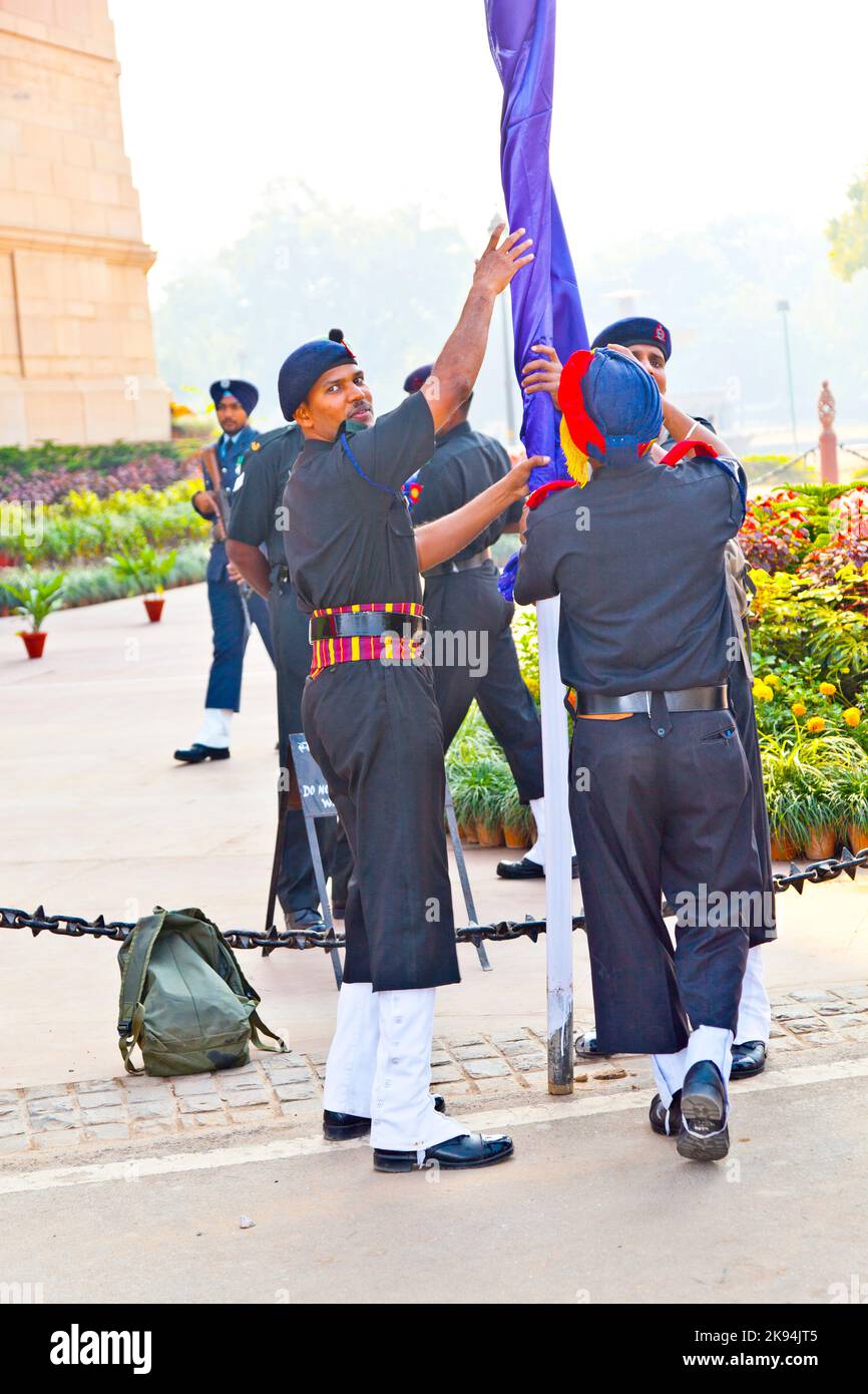 NEW DELHI - INDIA, NOV 18: soldiers rise the flag at the India Gate ...