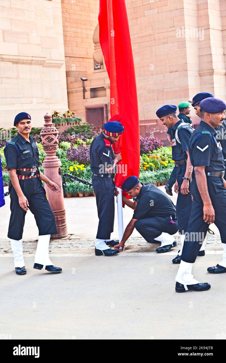 NEW DELHI - INDIA, NOV 18: soldiers rise the flag at the India Gate ...