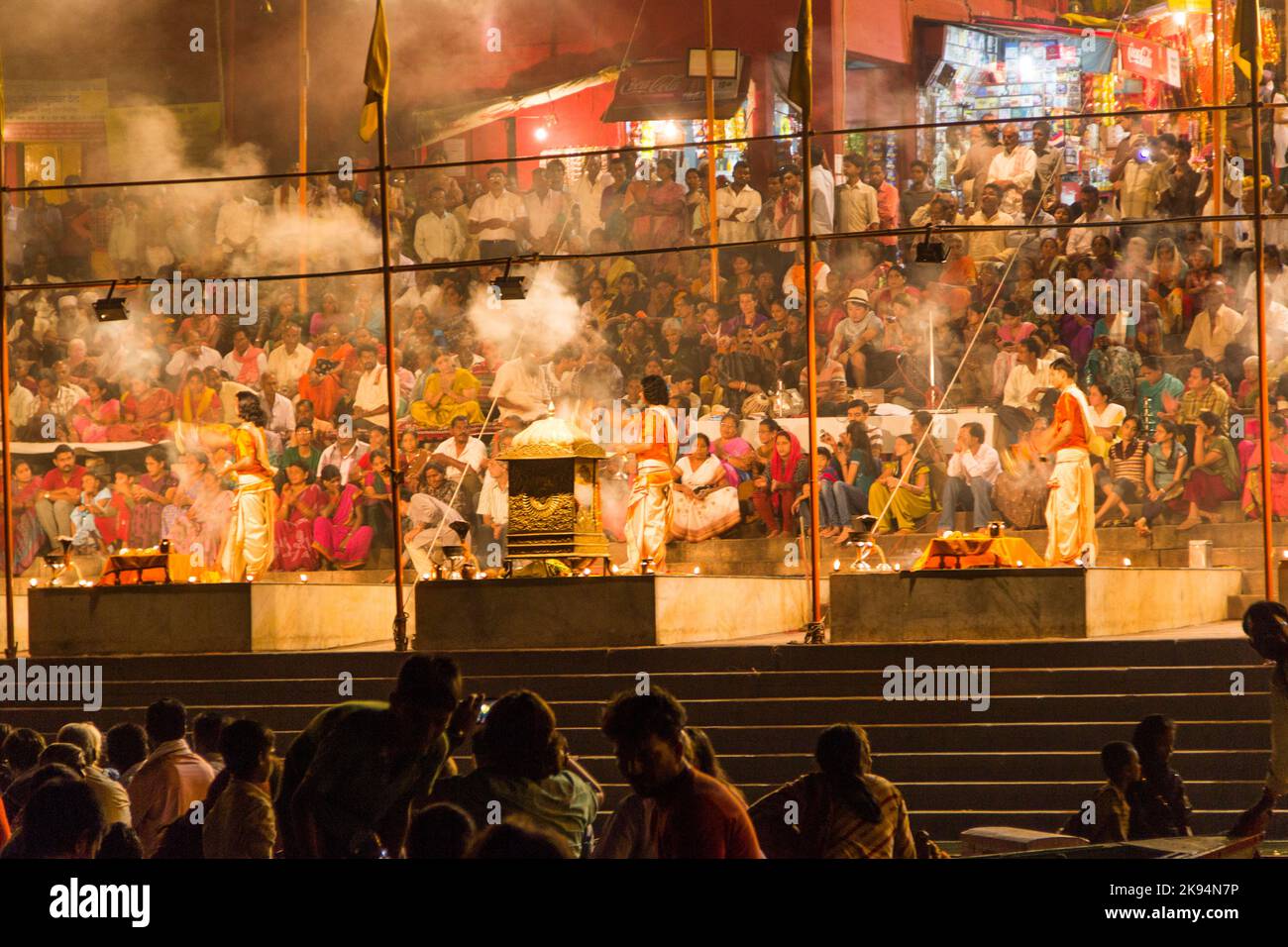 VARANASI, INDIA- MAY 4: Crowds of people worshiping bathing in the ...