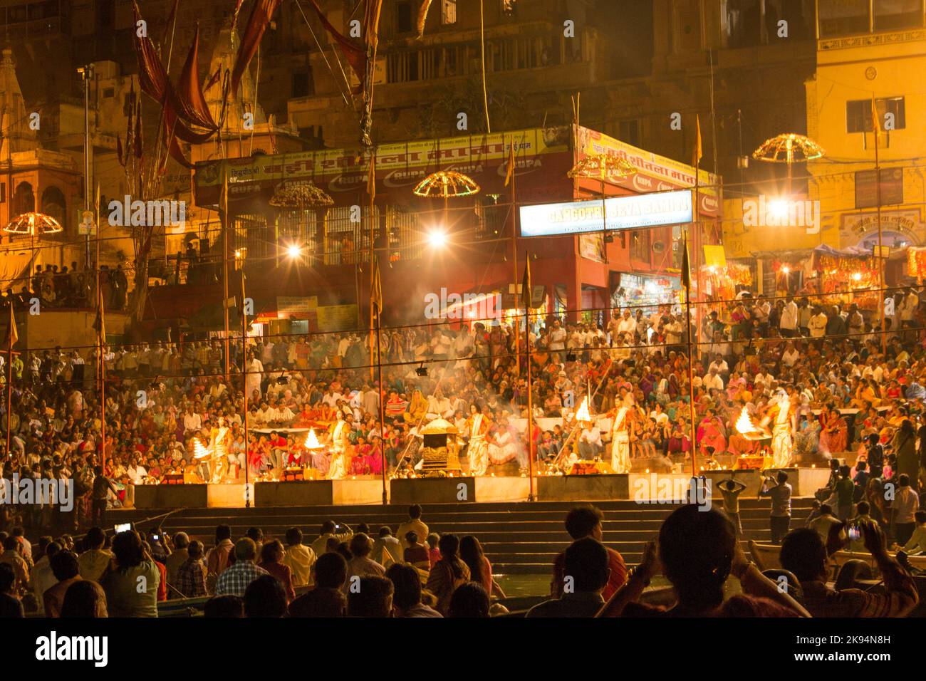 VARANASI, INDIA- MAY 4: Crowds of people worshiping bathing in the ...