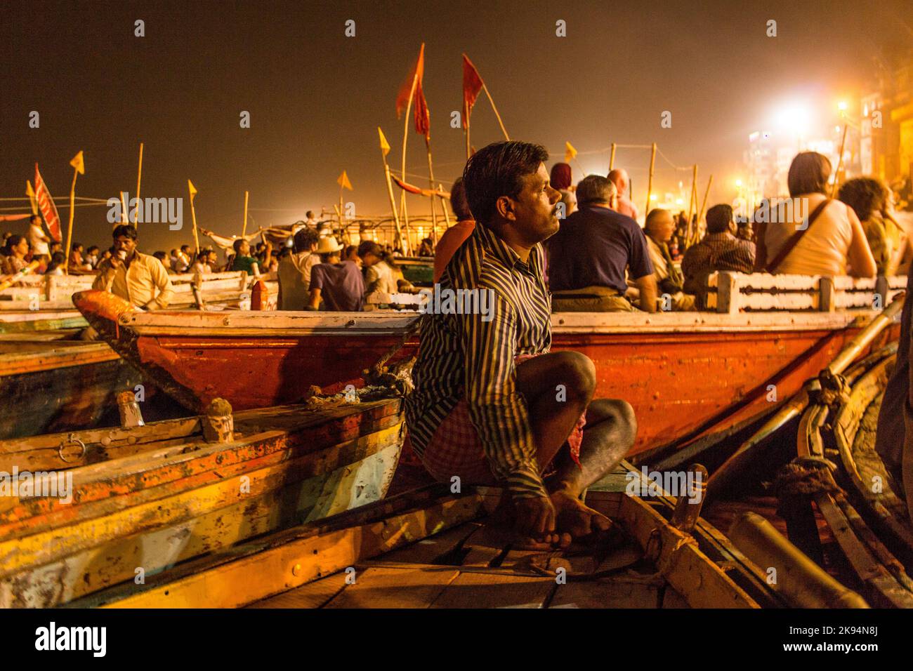 VARANASI, INDIA- MAY 4: Crowds of people worshiping bathing in the ...