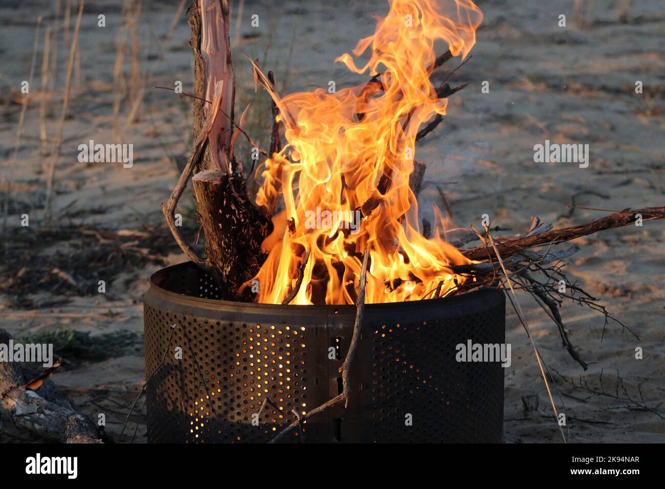 A closeup of a fire burning in a metallic bucket Stock Photo - Alamy
