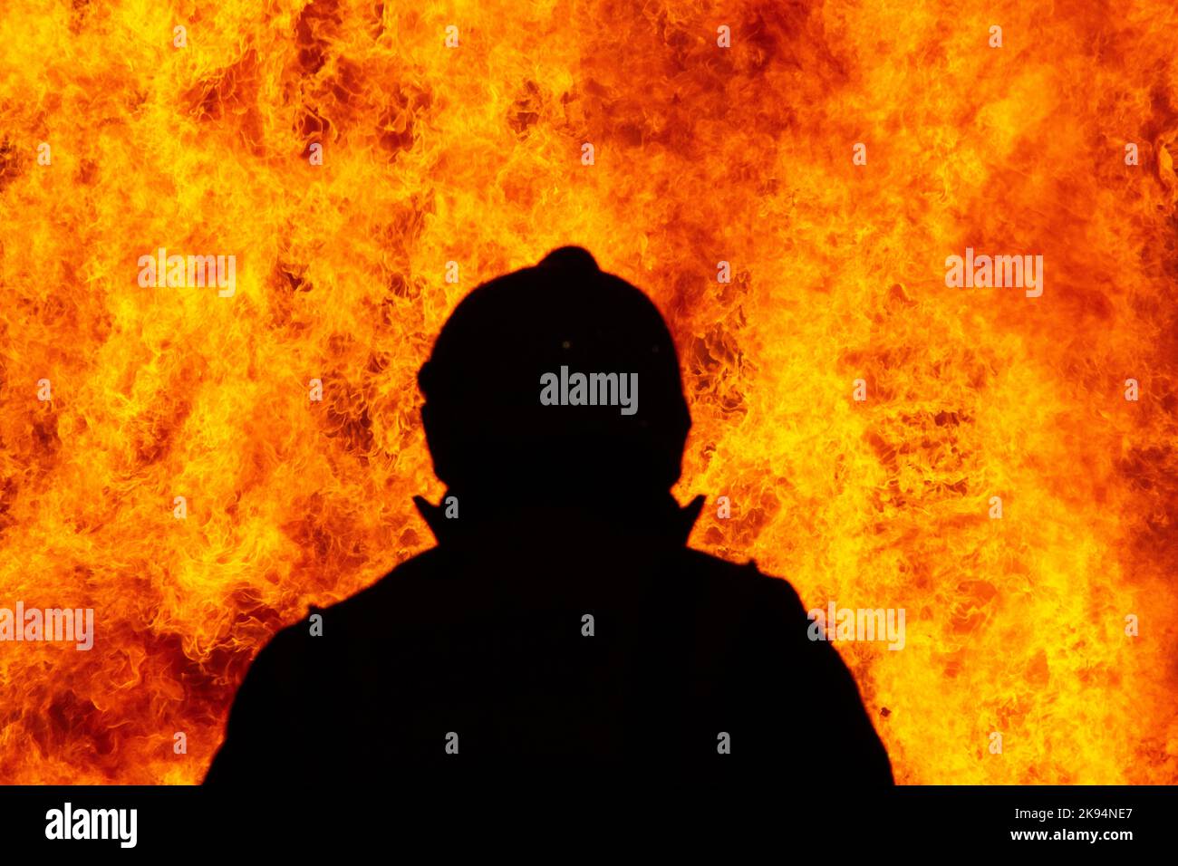 Firefighter putting out a fire. Accident and disaster. Protection Stock ...