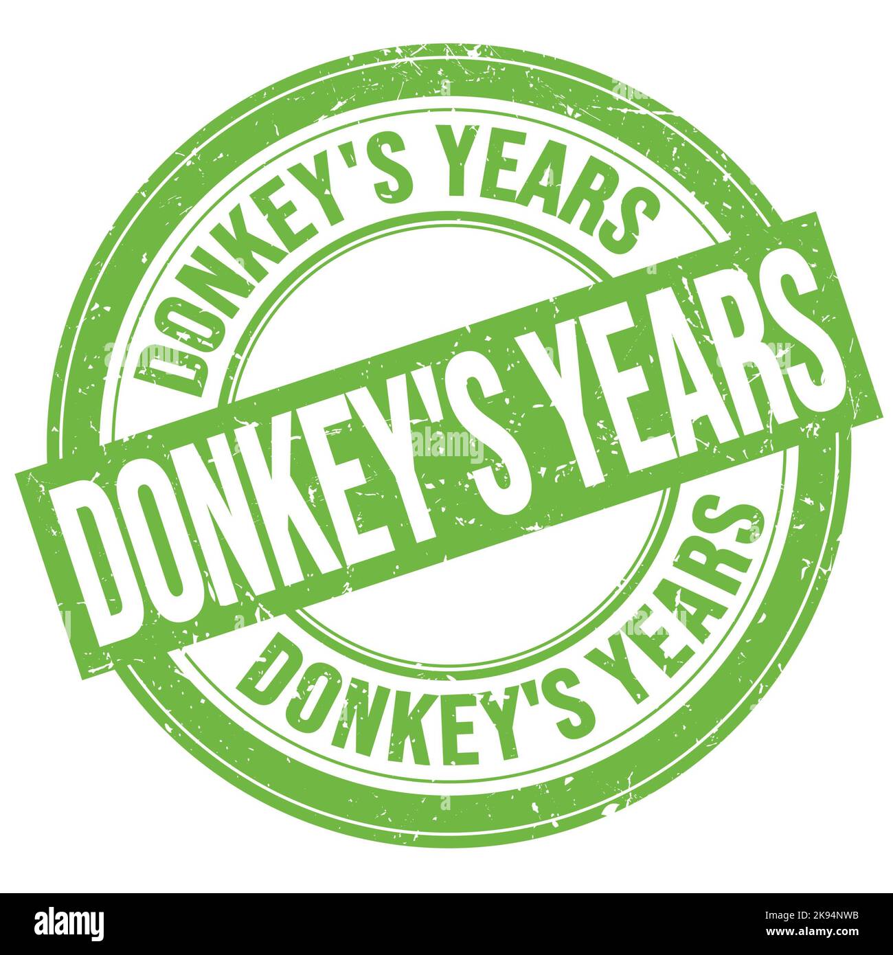 DONKEY'S YEARS text written on green round grungy stamp sign Stock ...