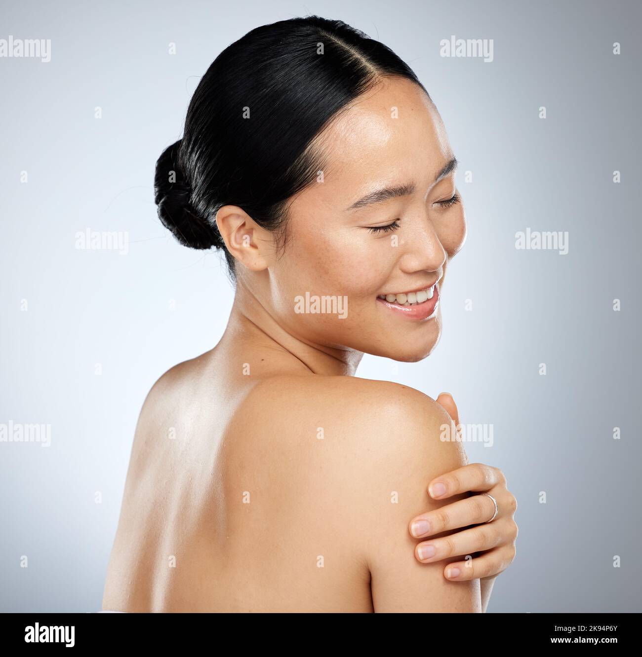 Skincare, beauty and body care with a model asian woman in studio on a ...