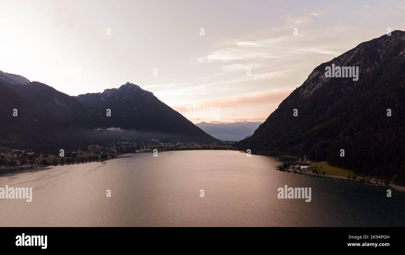 The mesmerizing Achen lake surrounded by mountains against the evening ...