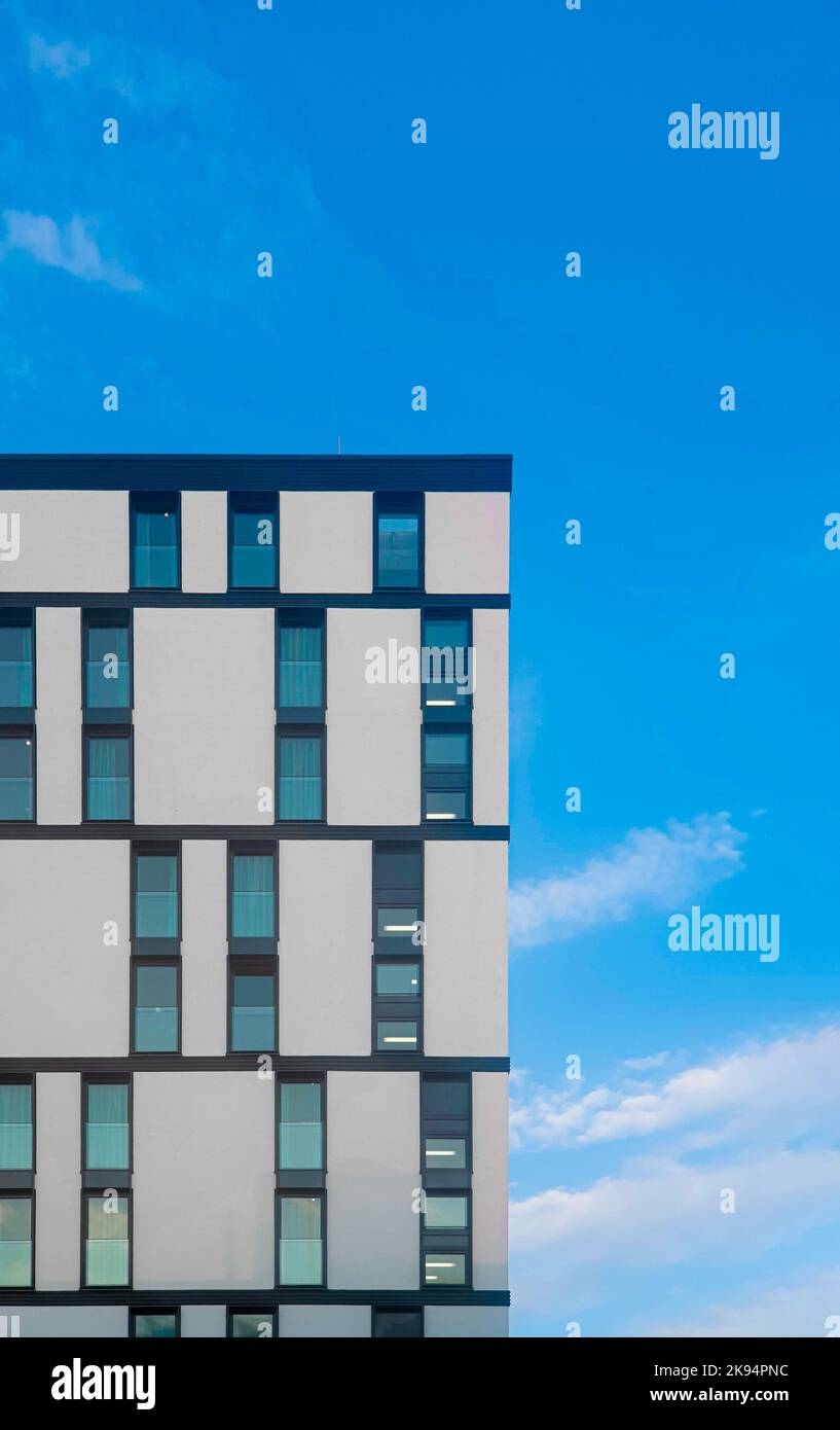 A vertical minimalistic shot of a modern building on the background of ...