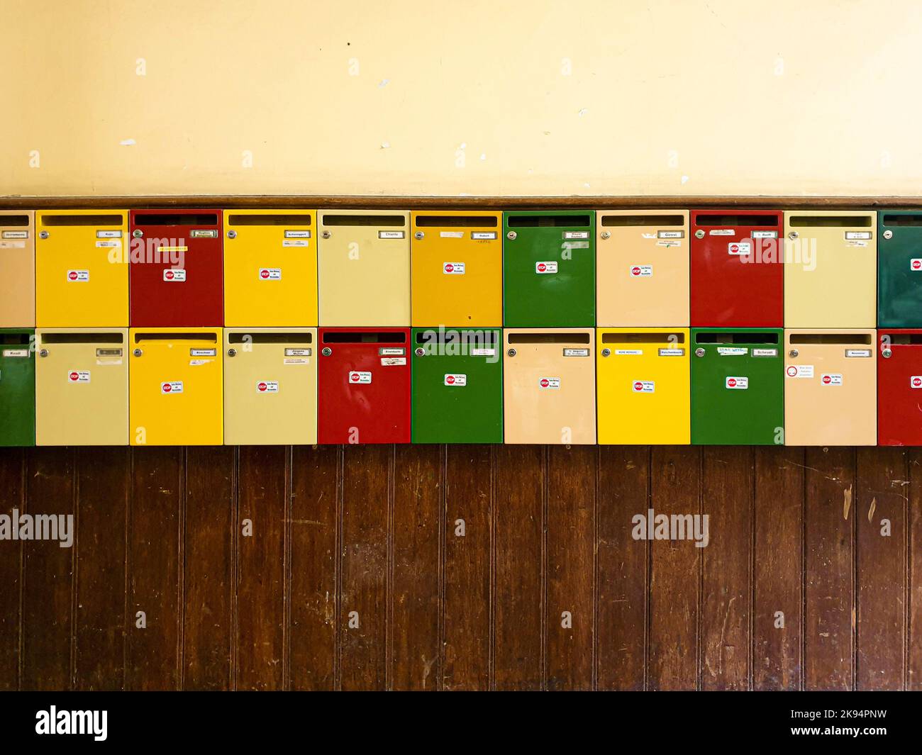 The colorful letter boxes on the wooden wall Stock Photo - Alamy