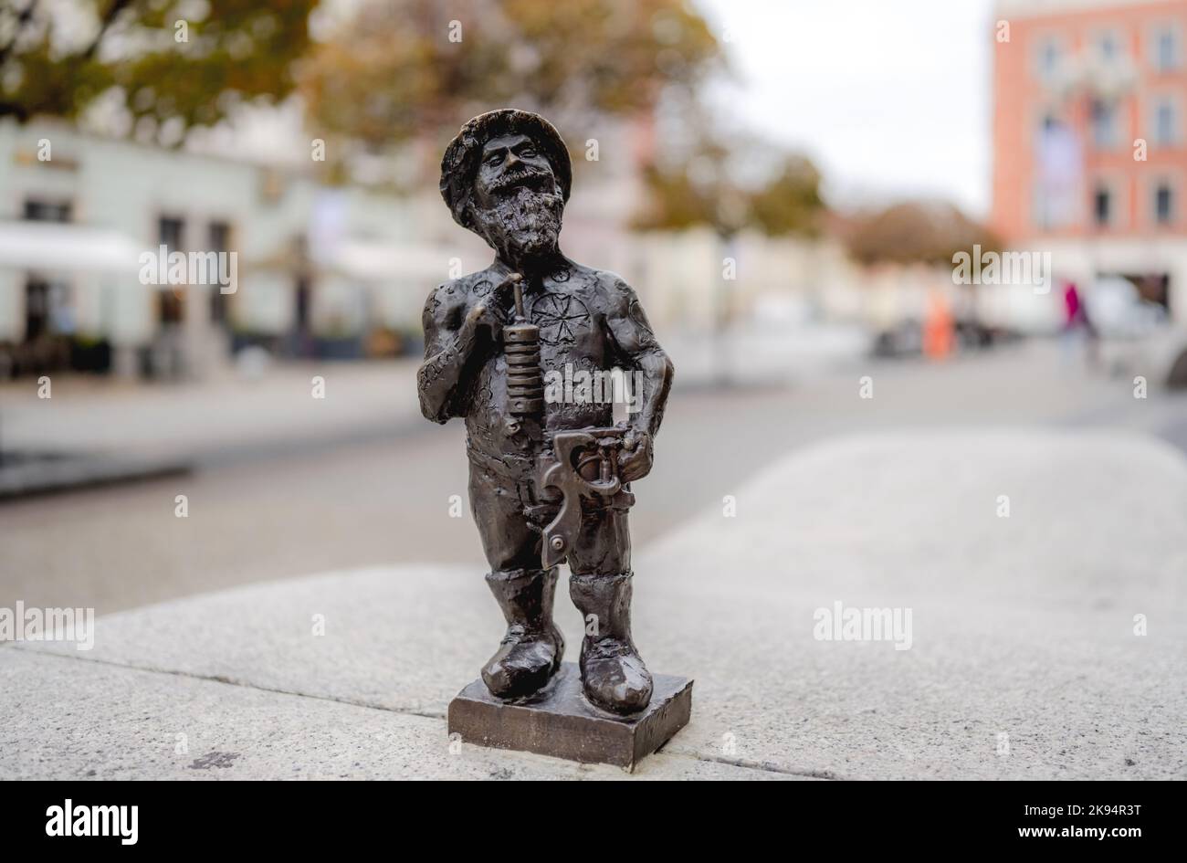 Sculpture of a dwarf made of copper, the symbol of Wroclaw. Tourist ...