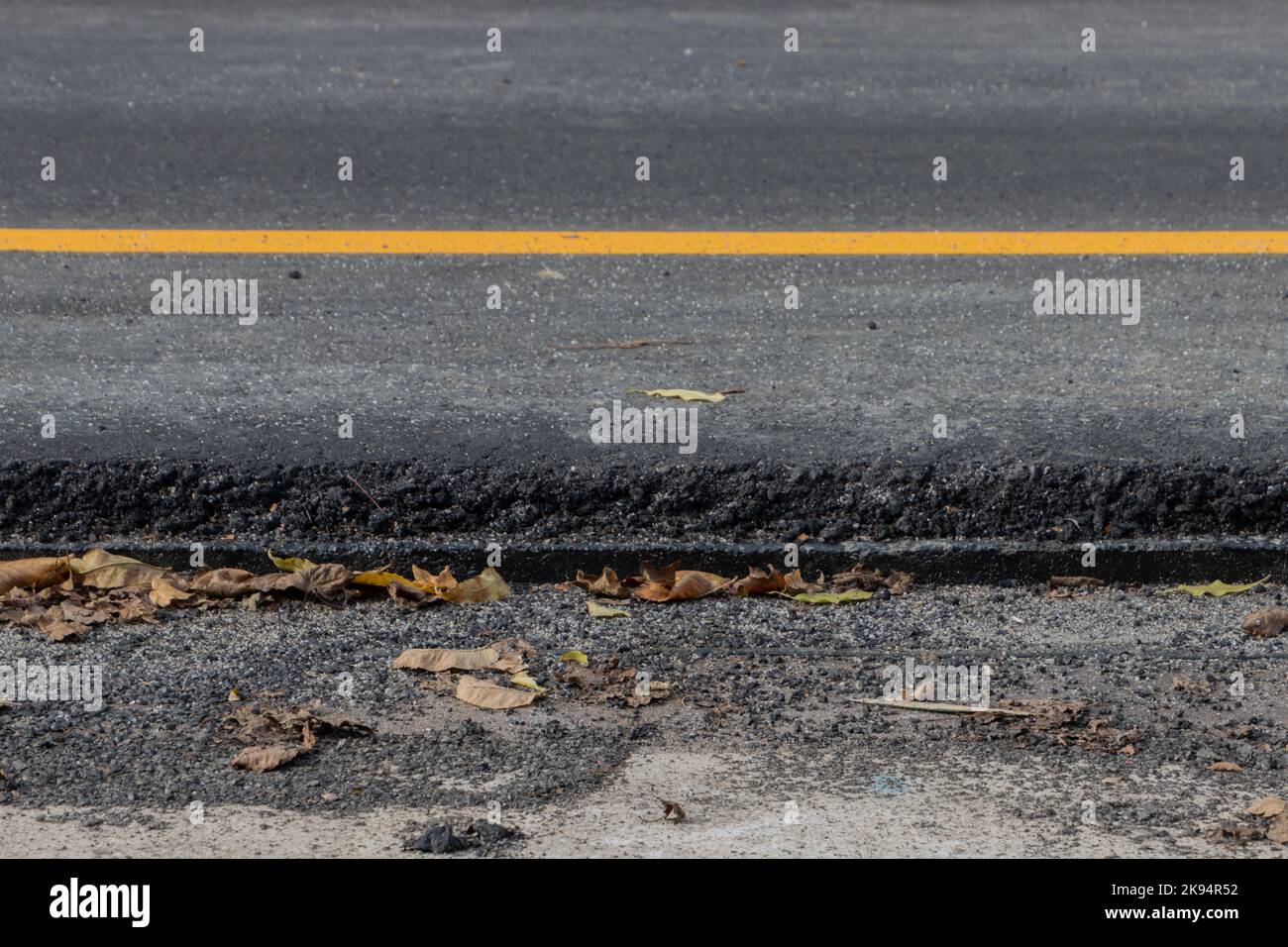 Side view of new layer of pavement Stock Photo - Alamy