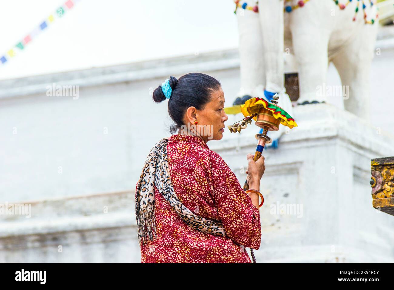 KATHMANDU, NEPAL - JUNE 17 : woman worships at bodhnath stuba on June ...