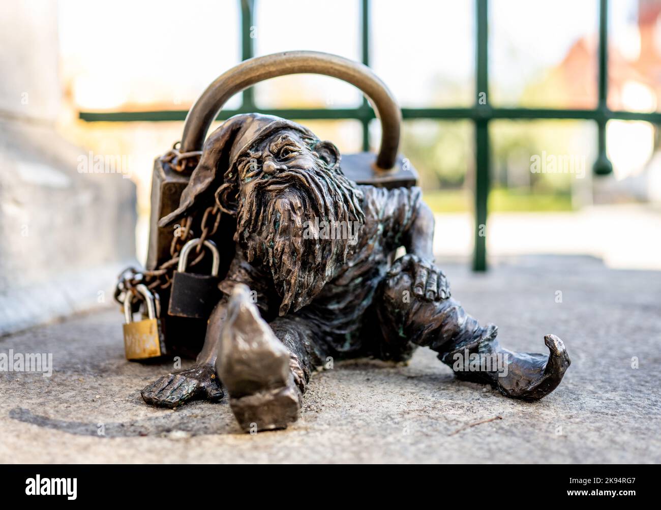 Dwarf with a padlock near bridge Stock Photo - Alamy