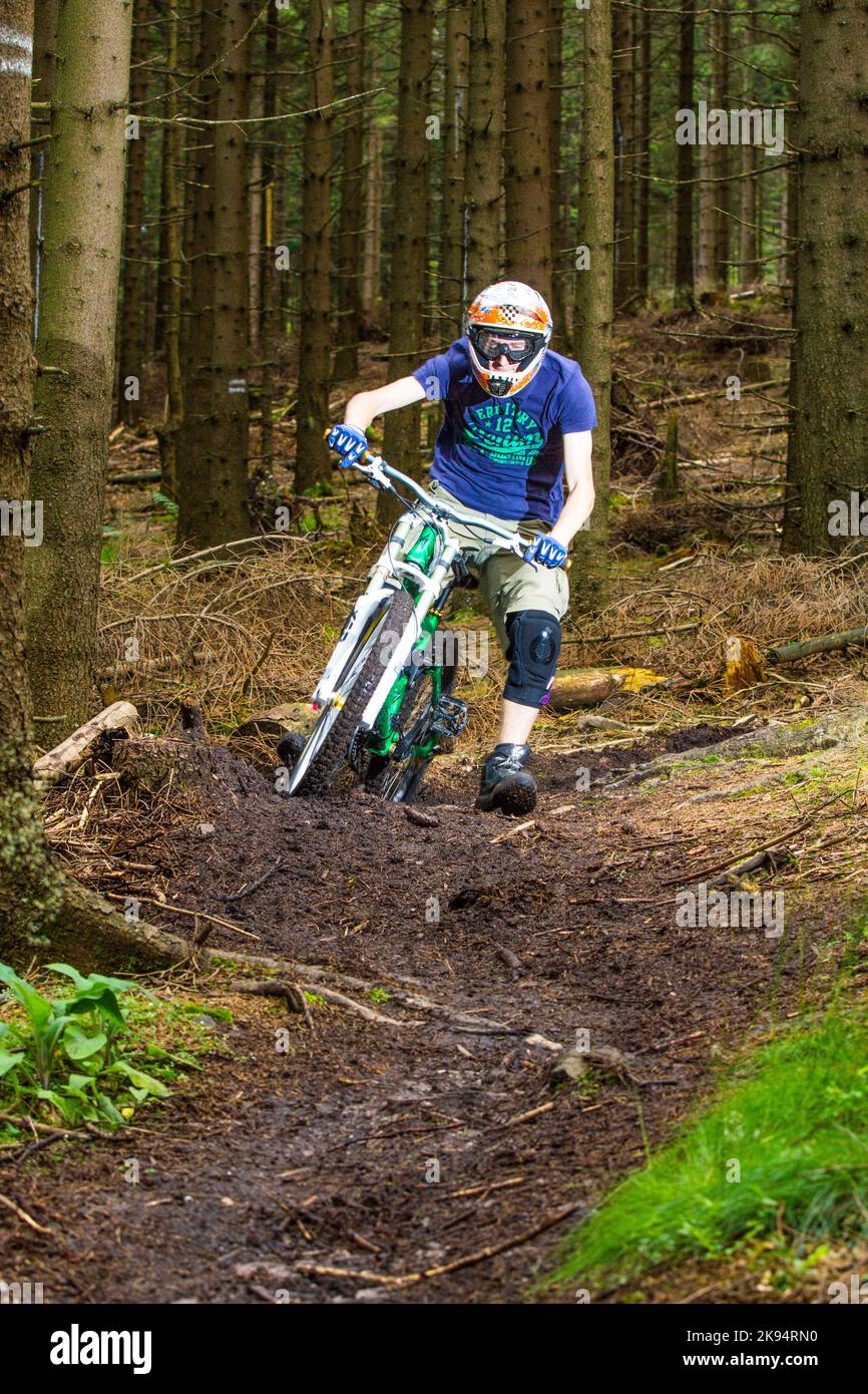 KRONBERG, GERMANY - JULY 7: downhill biker jumps over a ramp in the ...