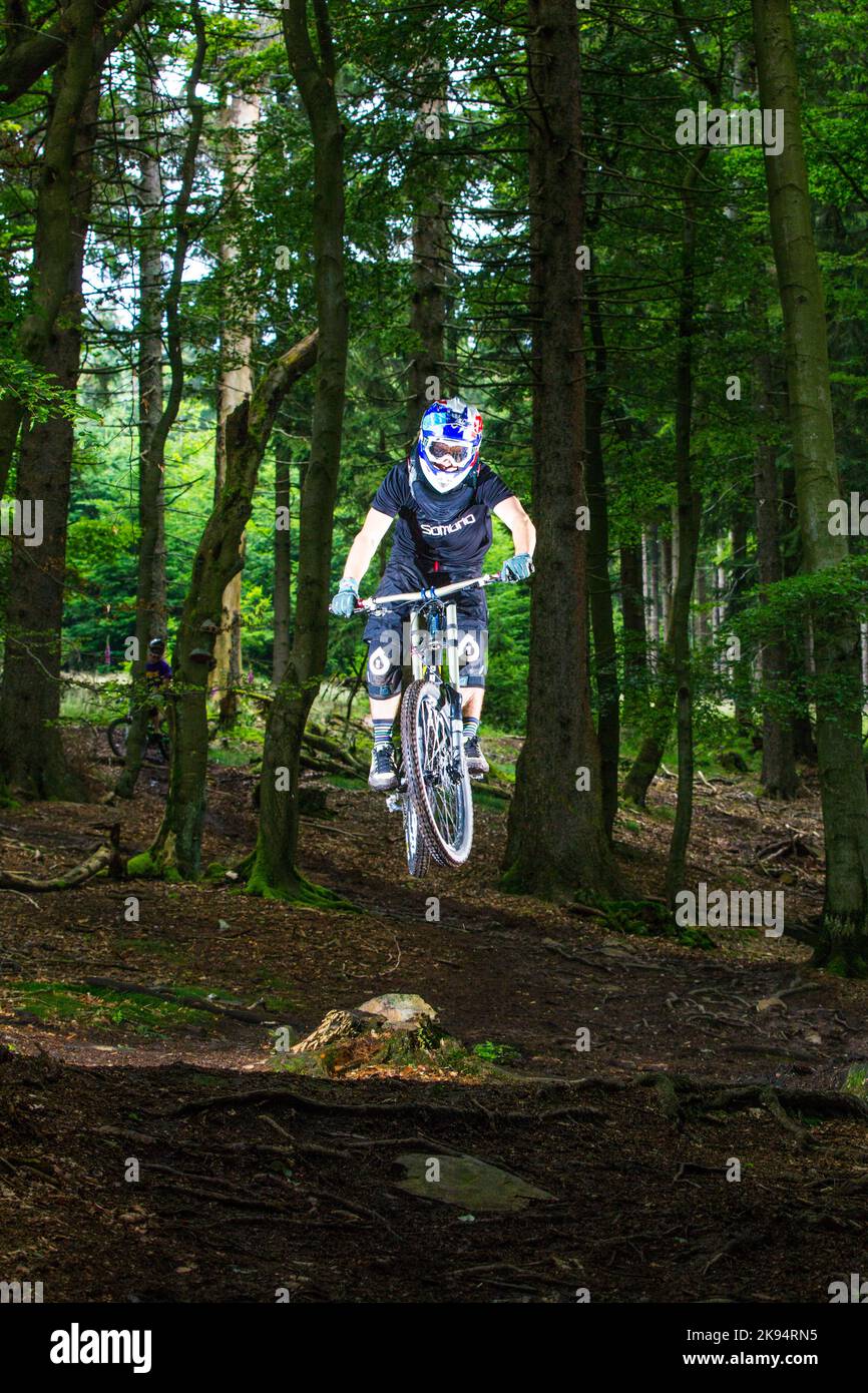 KRONBERG, GERMANY - JULY 7: downhill biker jumps over a ramp in the ...