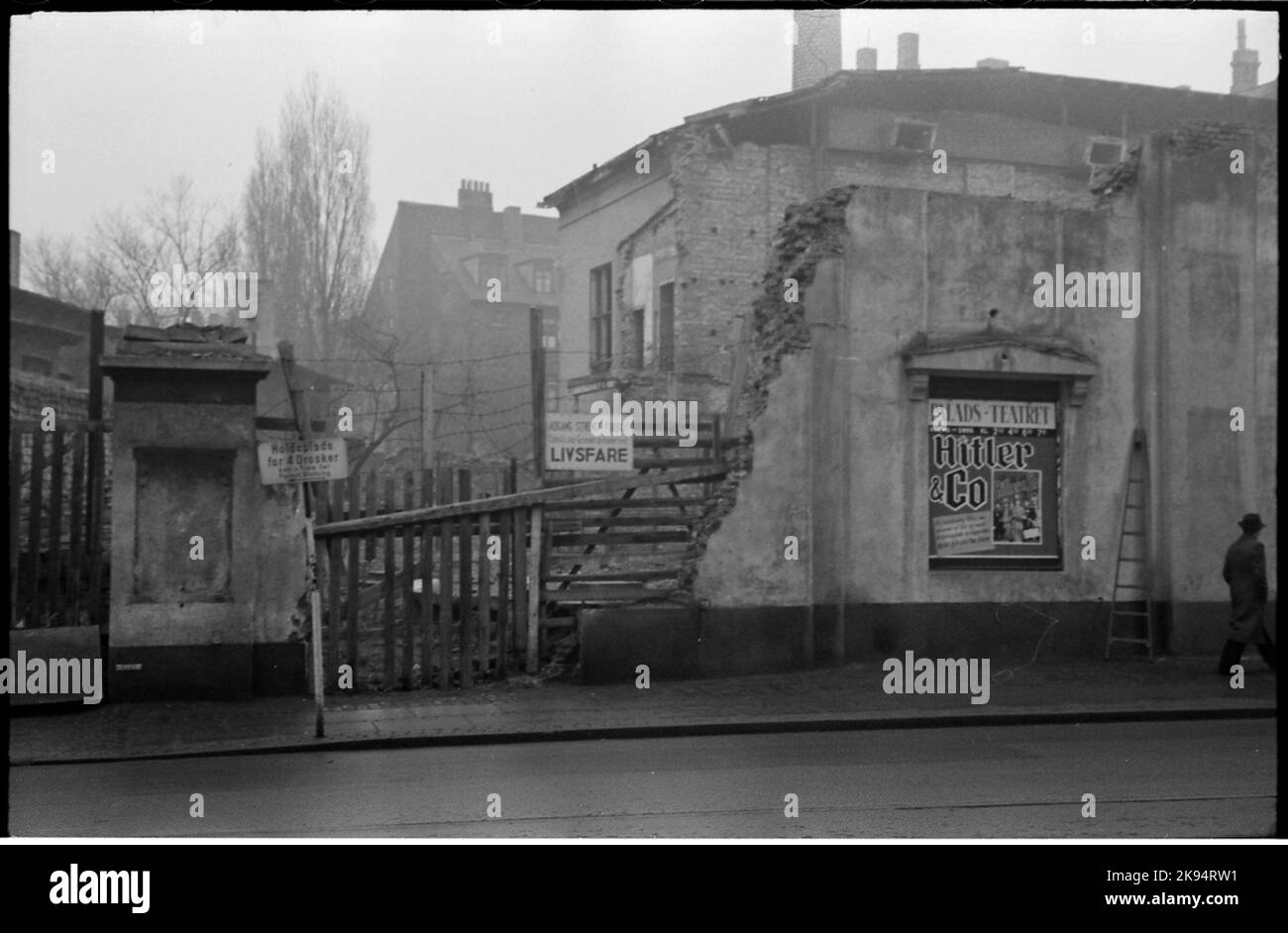 War -damaged building with a bio poster Stock Photo - Alamy