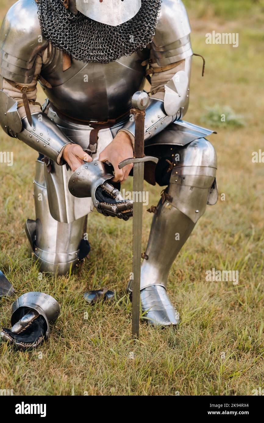 Close-up of a medieval knight in armor preparing for battle Stock Photo ...