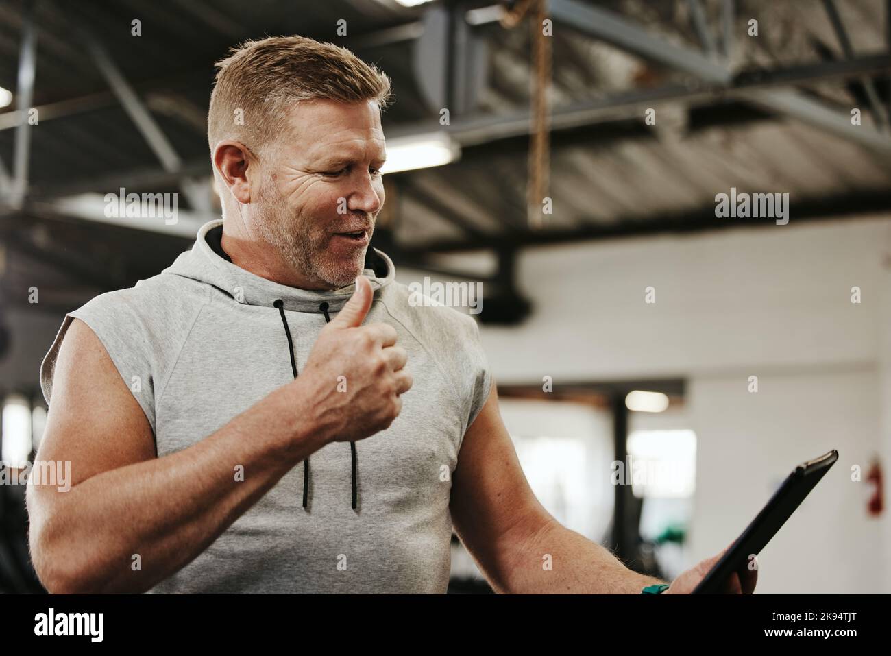 Thumbs up, personal trainer and video call on a tablet for digital ...