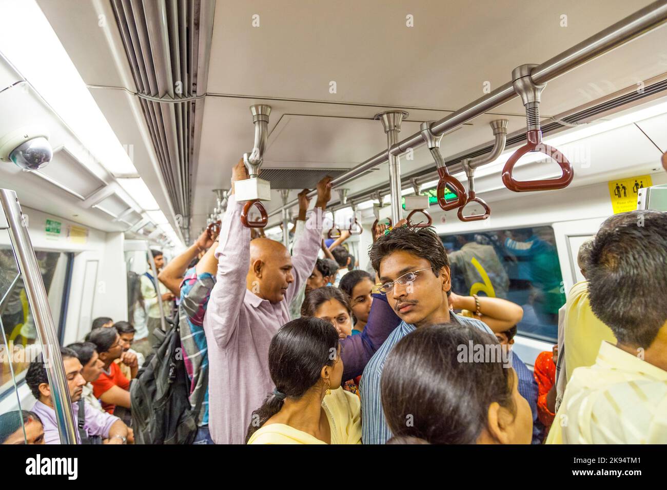 DELHI, INDIA - OCTOBER 16: passengers ride in metro train on October 16 ...