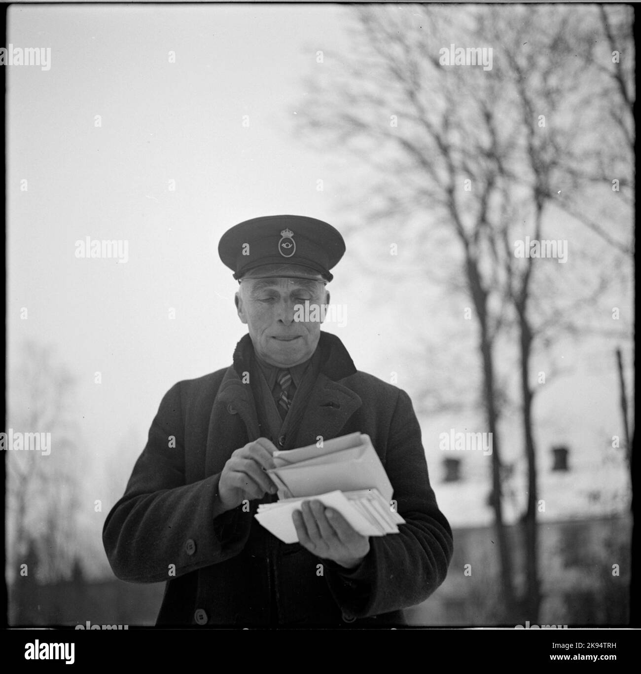 Postman at work Stock Photo - Alamy