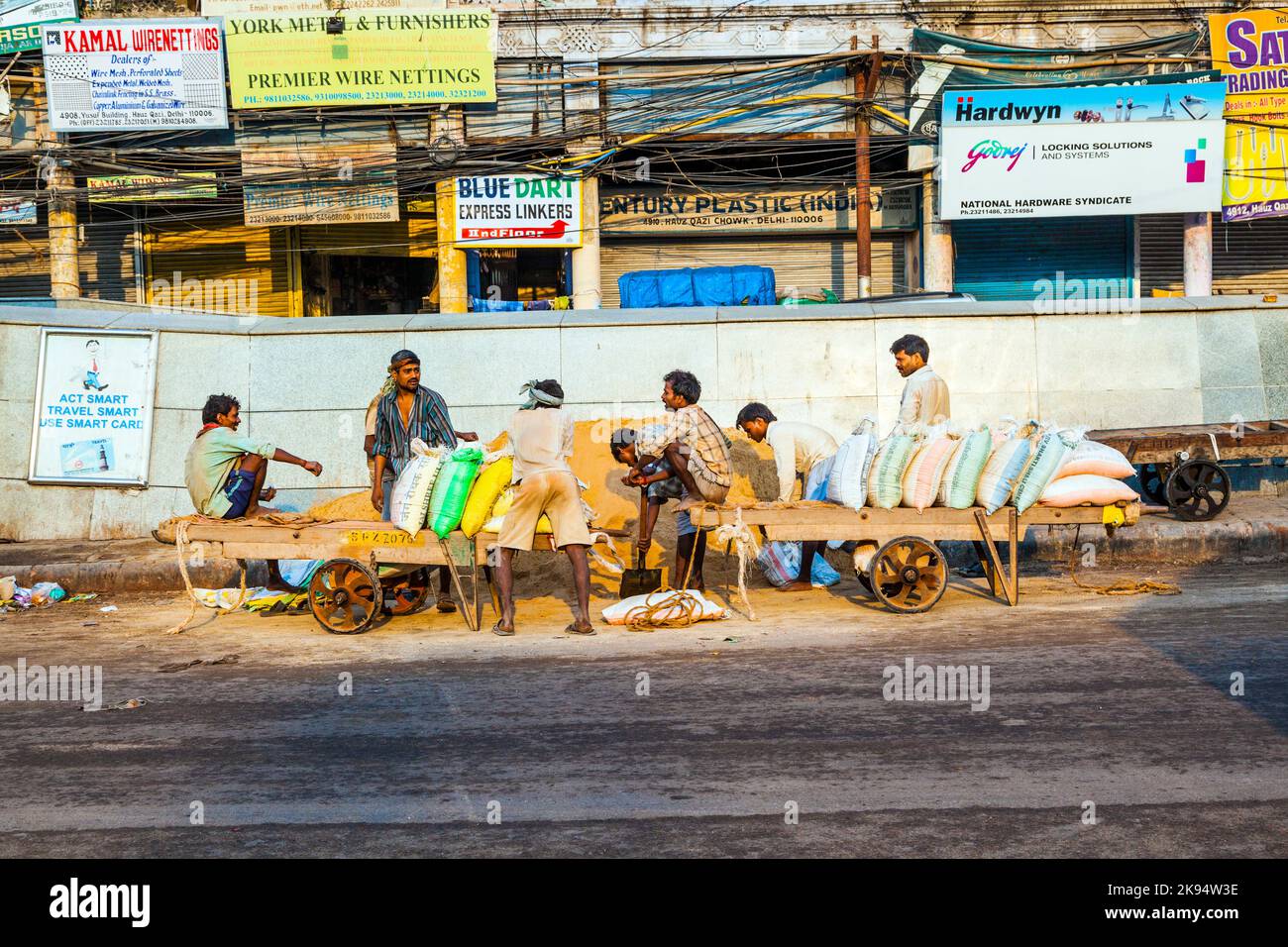 DELHI, INDIA - OCT 16: day worker wait for start of job on Oct 16,2012 ...